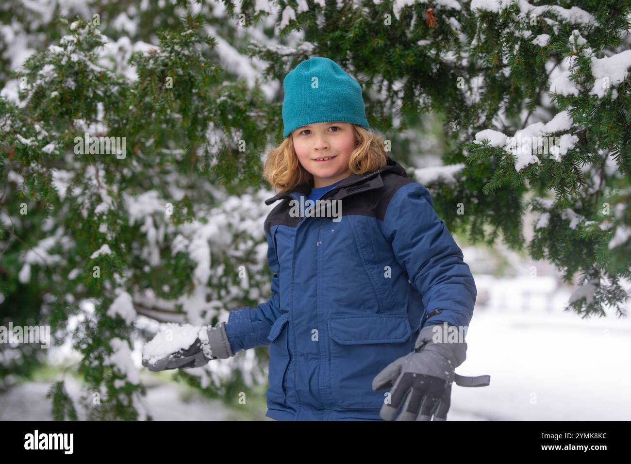 Kids play with snow in winter park. First Winter snow. Kids winters ...