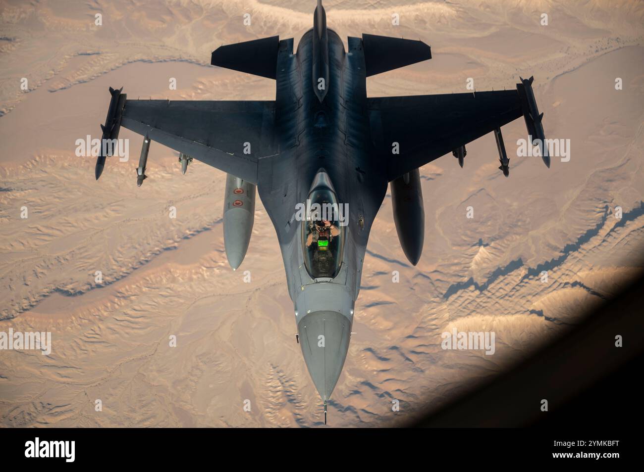 A U.S. Air Force F-16 Fighting Falcon prepares to be refueled over the ...