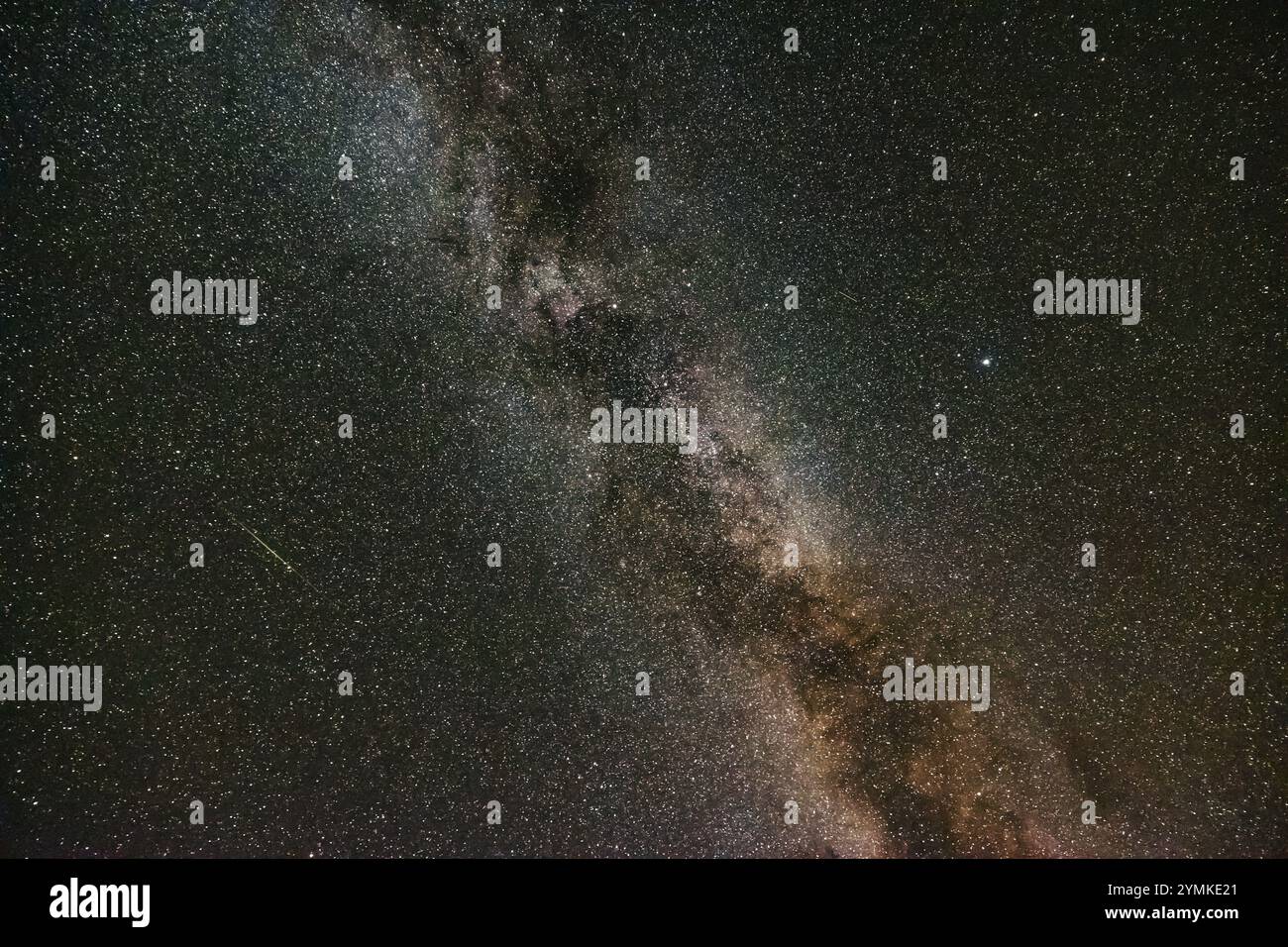 The Milky Way and a little meteor with trail. Space background photo ...