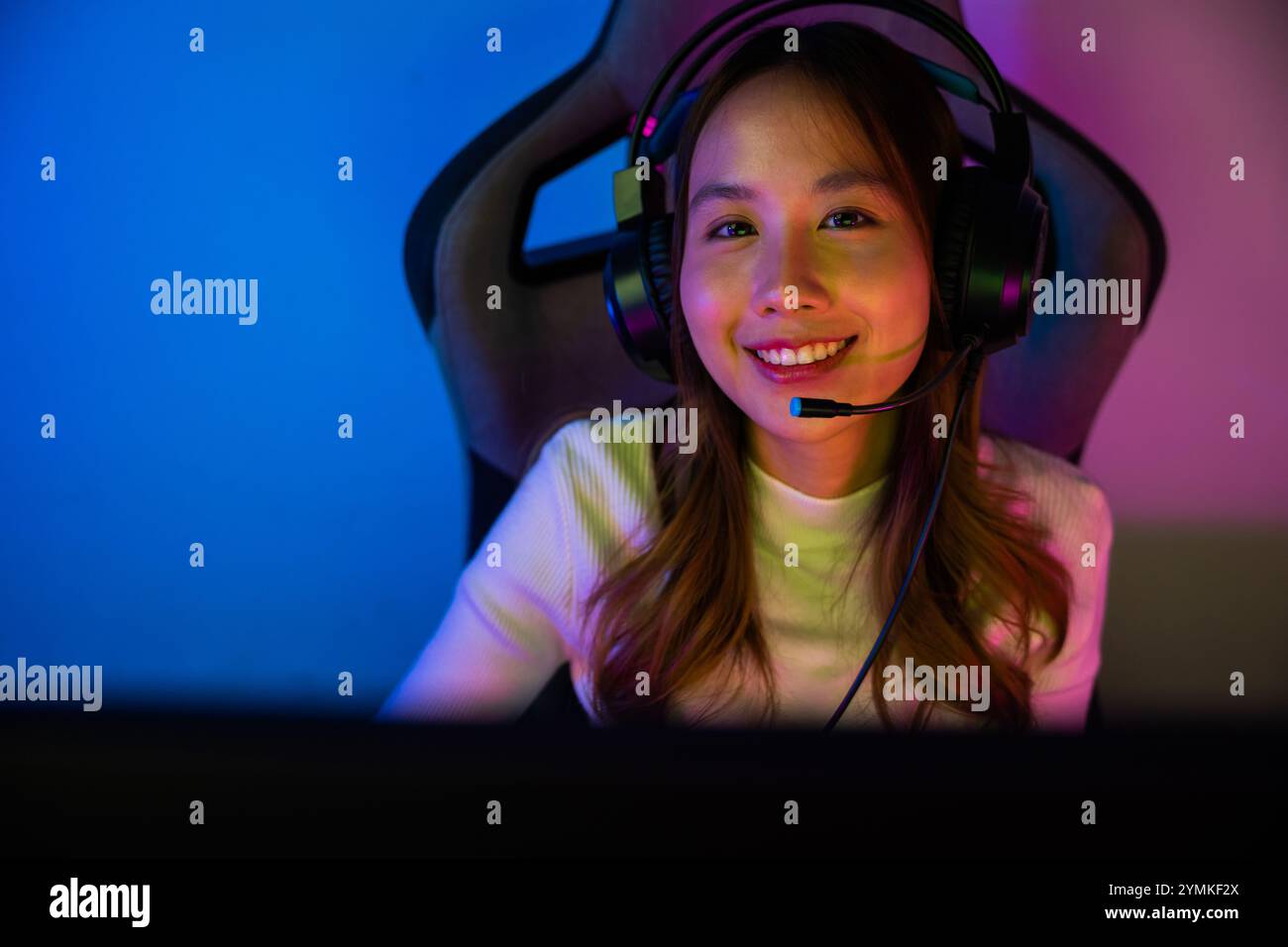 Asian happy Gamer endeavor plays online video games tournament with ...