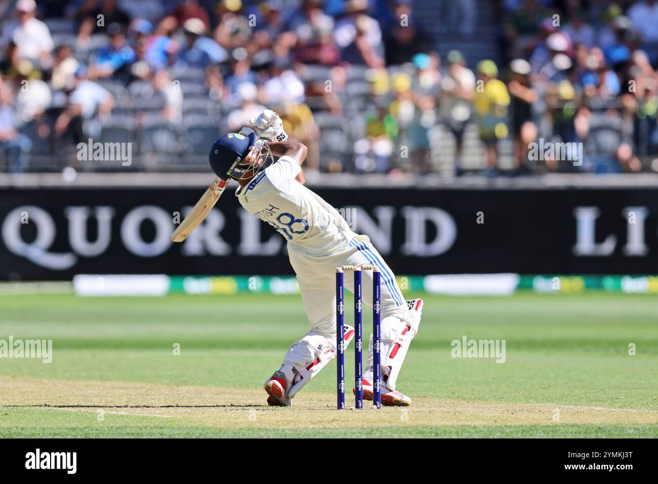 India's Nitish Kumar Reddy hits a six during play in the first cricket ...