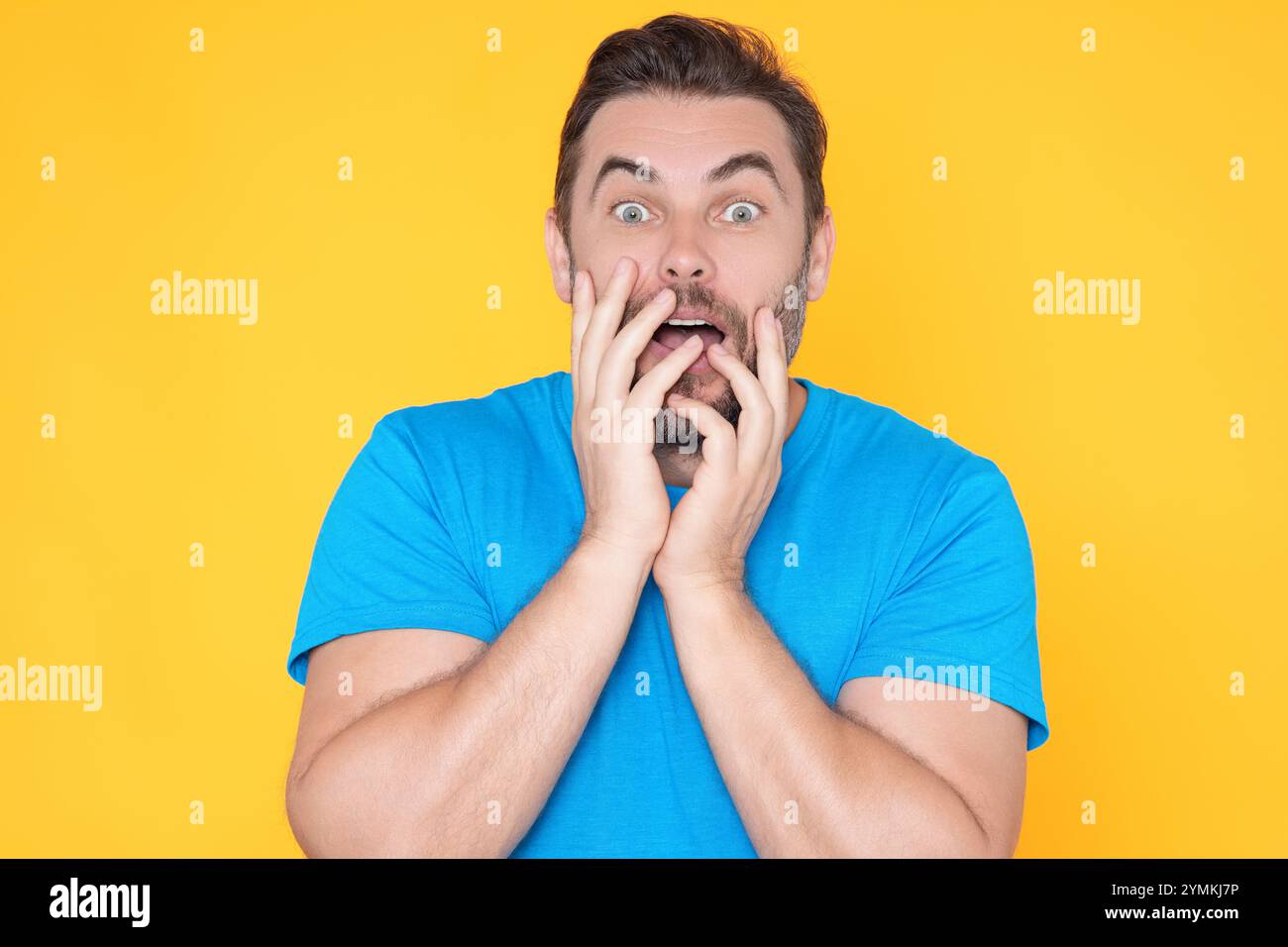 Studio isolated portrait of middle aged man with surprise facial ...
