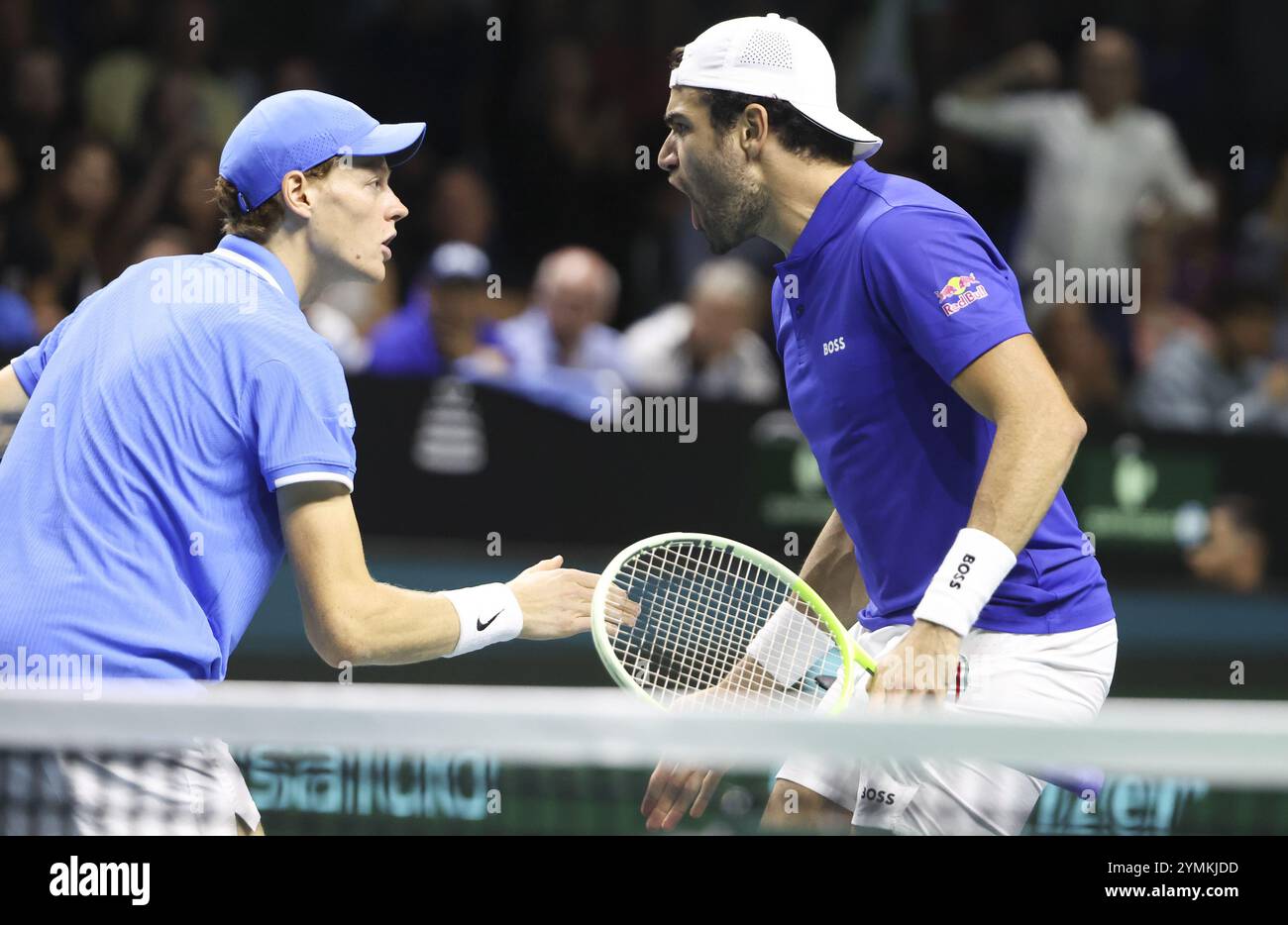 Matteo Berrettini (white cap) and Jannik Sinner (blue cap) of Italy ...