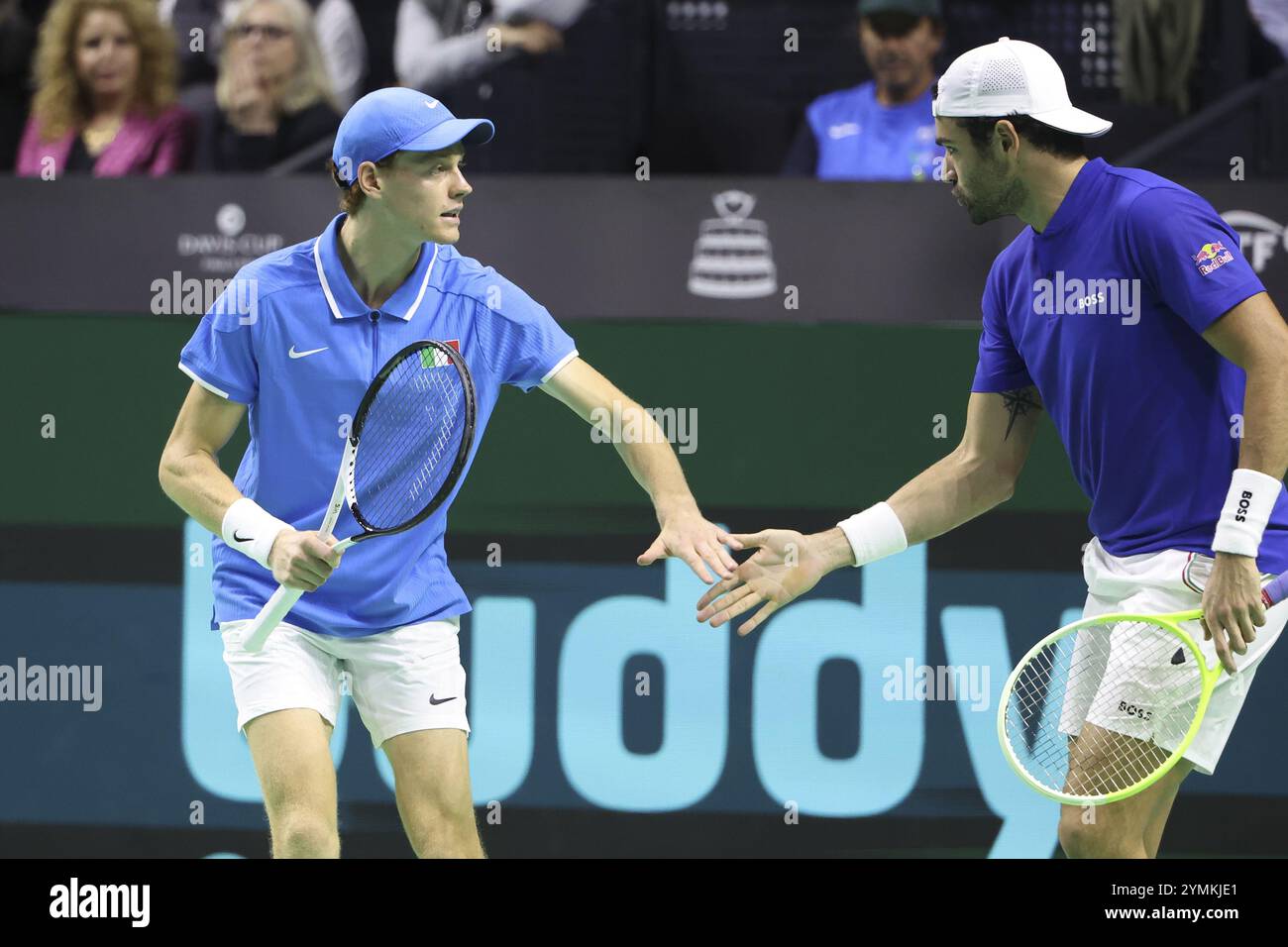 Matteo Berrettini (white cap) and Jannik Sinner (blue cap) of Italy ...