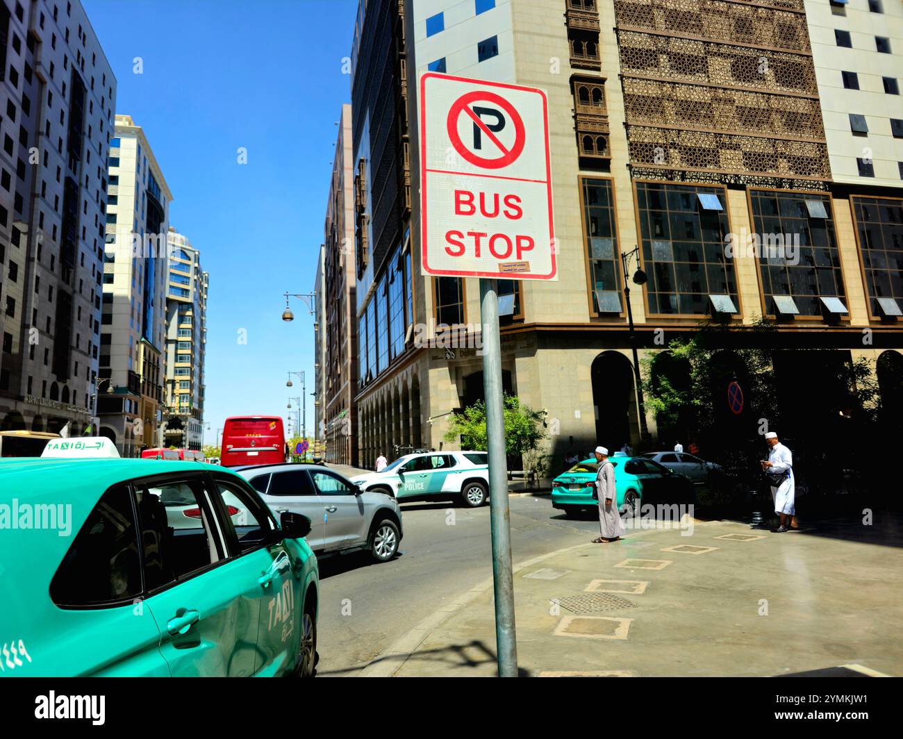 Medina, Saudi Arabia, June 28 2024: A bus stop sign with a no parking ...