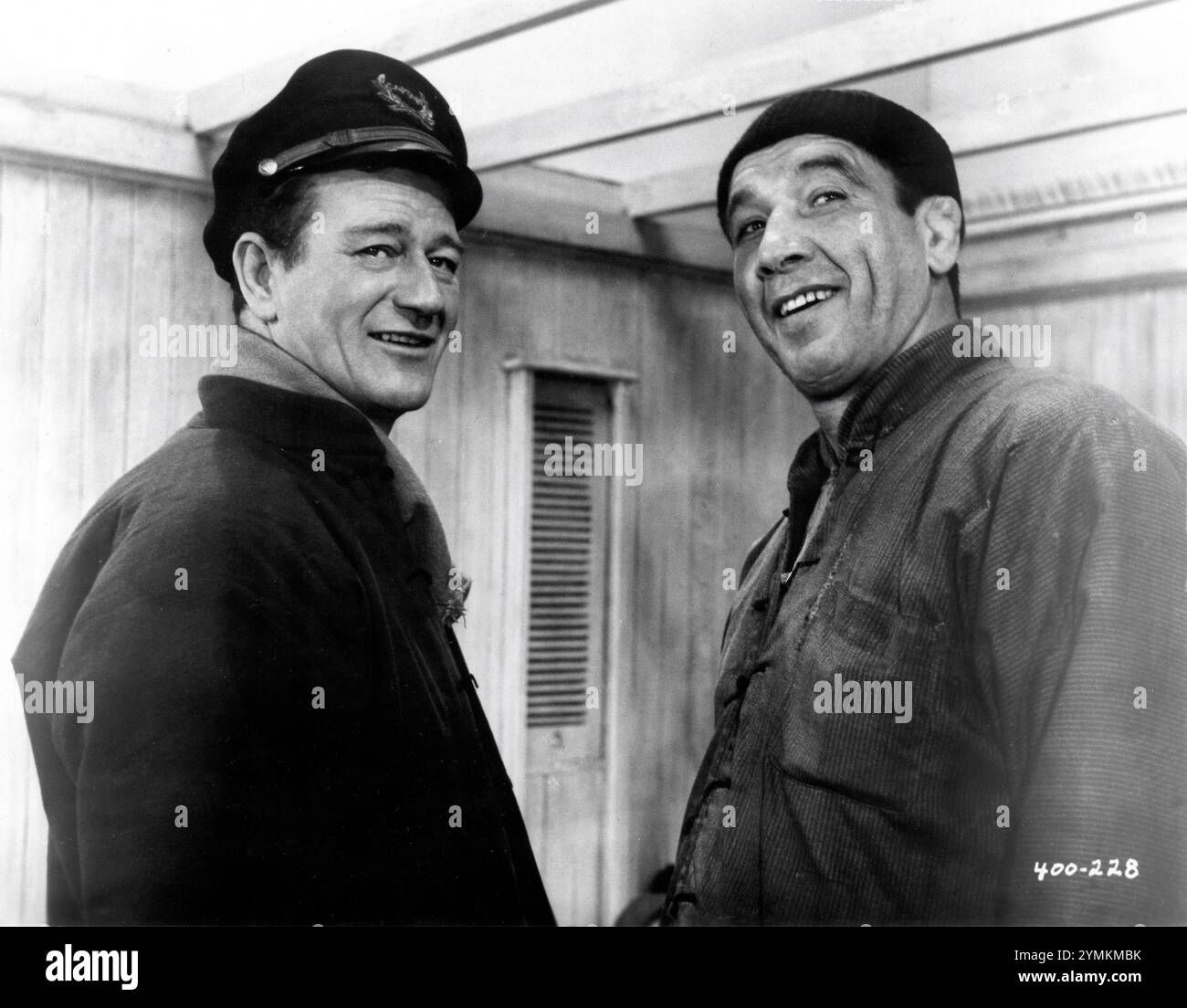 JOHN WAYNE and MIKE MAZURKI in BLOOD ALLEY 1955 director WILLIAM A ...