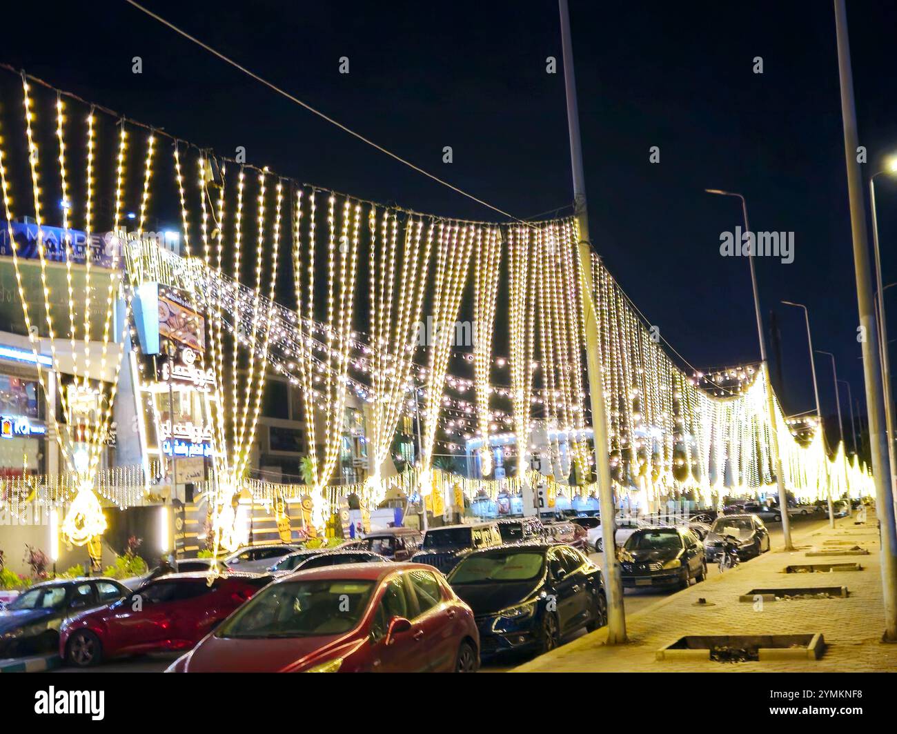 Cairo, Egypt, November 13 2024: lots of celebration lights in new Cairo city street at night ...