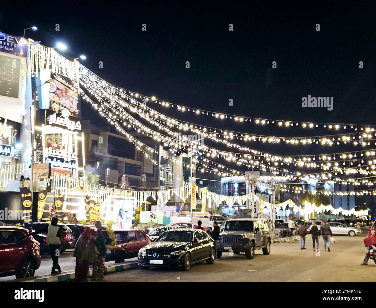 Cairo, Egypt, November 14 2024: lots of celebration lights in new Cairo city street at night ...