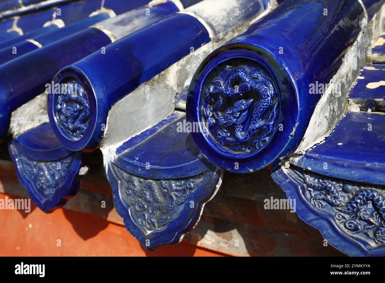 The blue glazed tiles on the wall as the background, the traditional ...