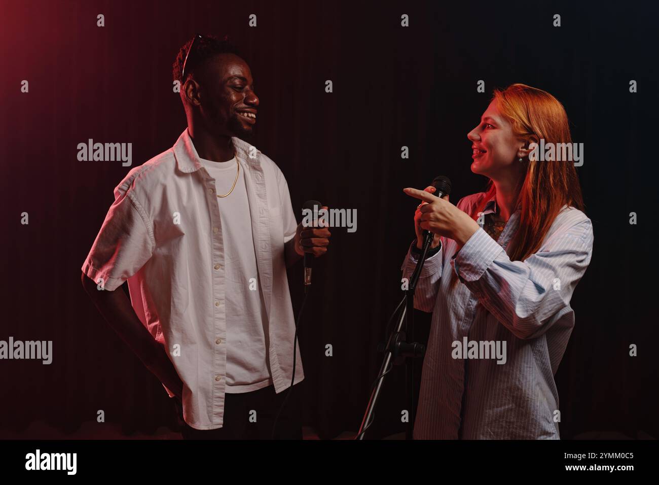 Engaging in Conversation Between Two Musicians Stock Photo - Alamy