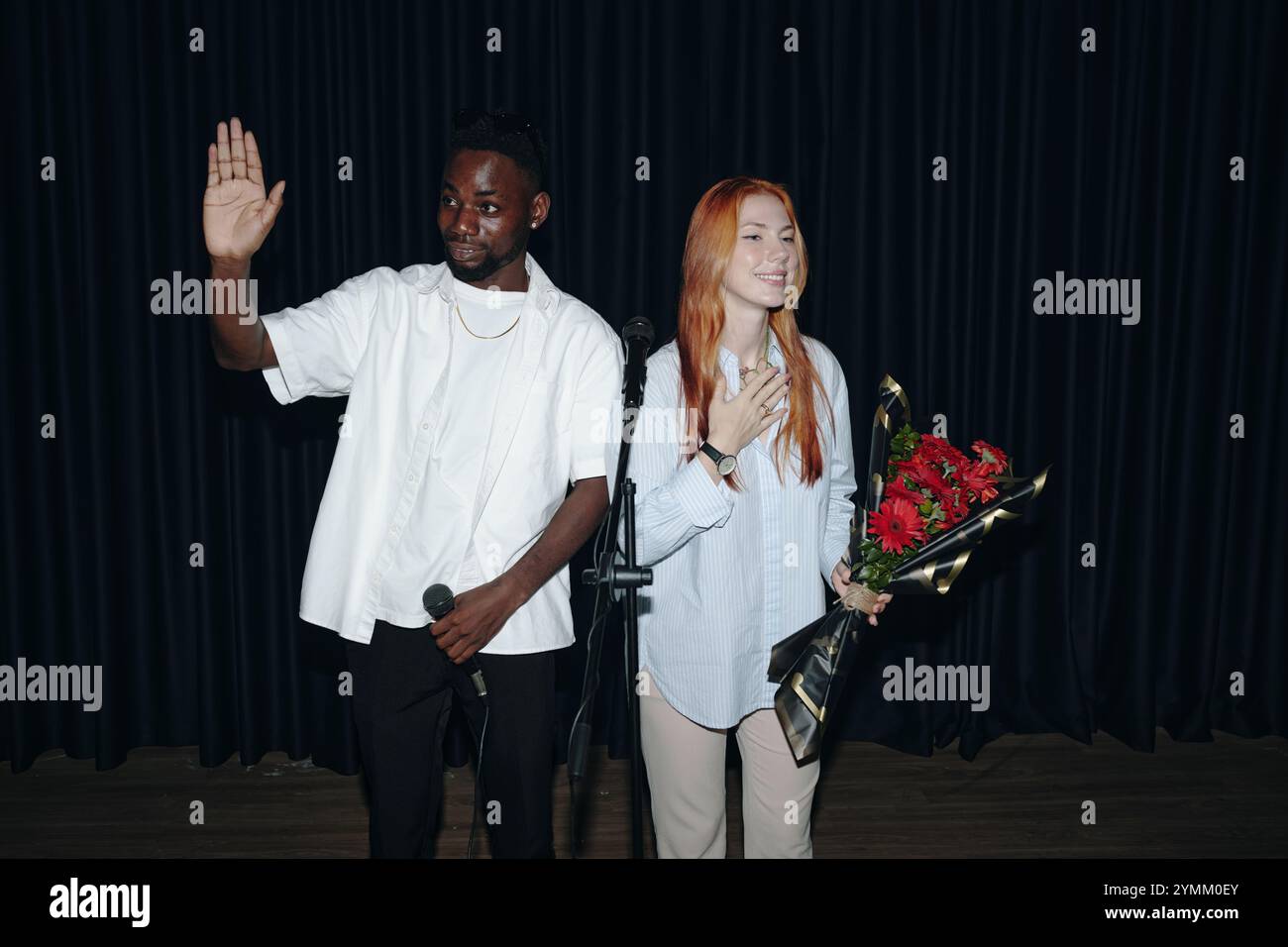 Expressing Gratitude After Performance on Stage Stock Photo - Alamy