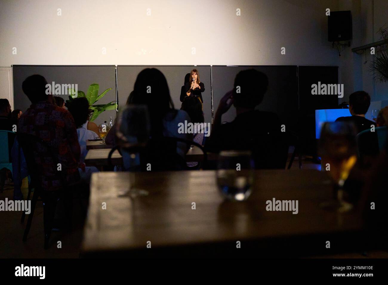 Female performer delivering a monologue on stage in an alternative ...