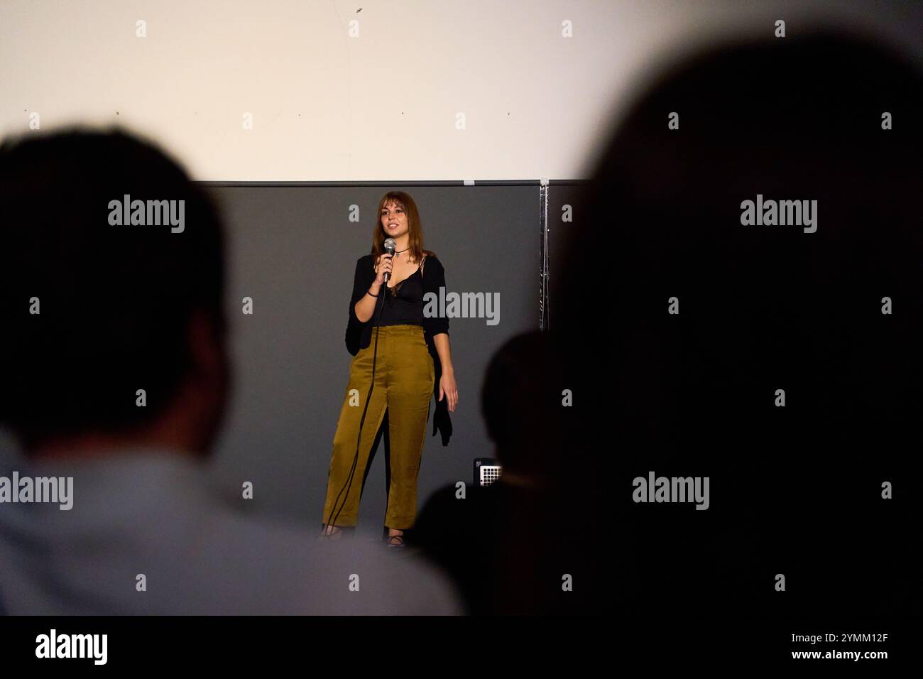 Female performer delivering a monologue on stage in an alternative ...