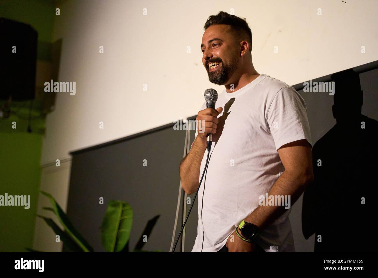 Male performer delivering a monologue on stage in an alternative ...