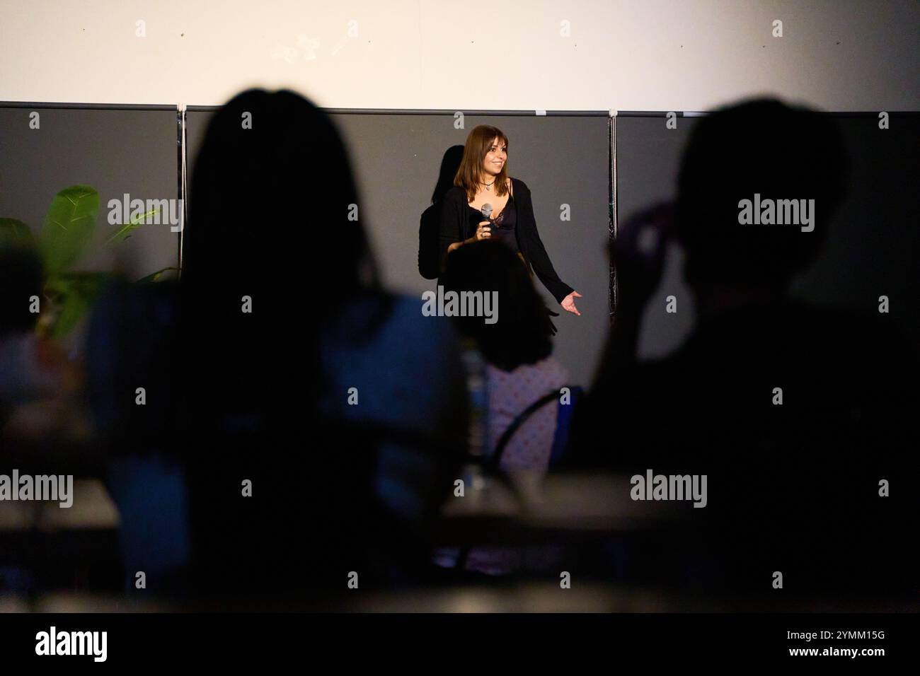 Female performer delivering a monologue on stage in an alternative ...