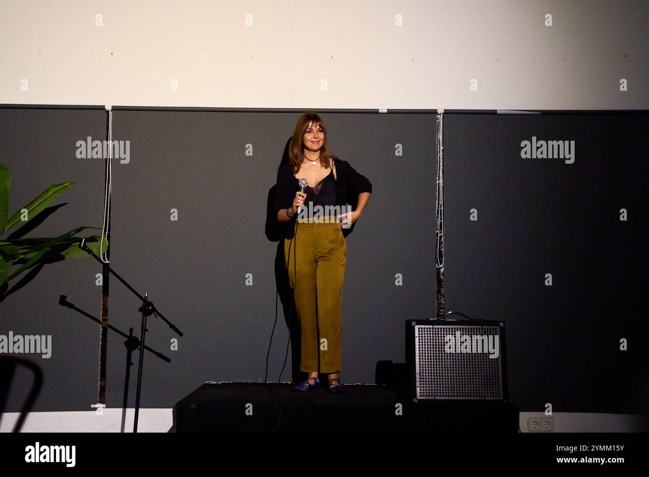 Female performer delivering a monologue on stage in an alternative ...