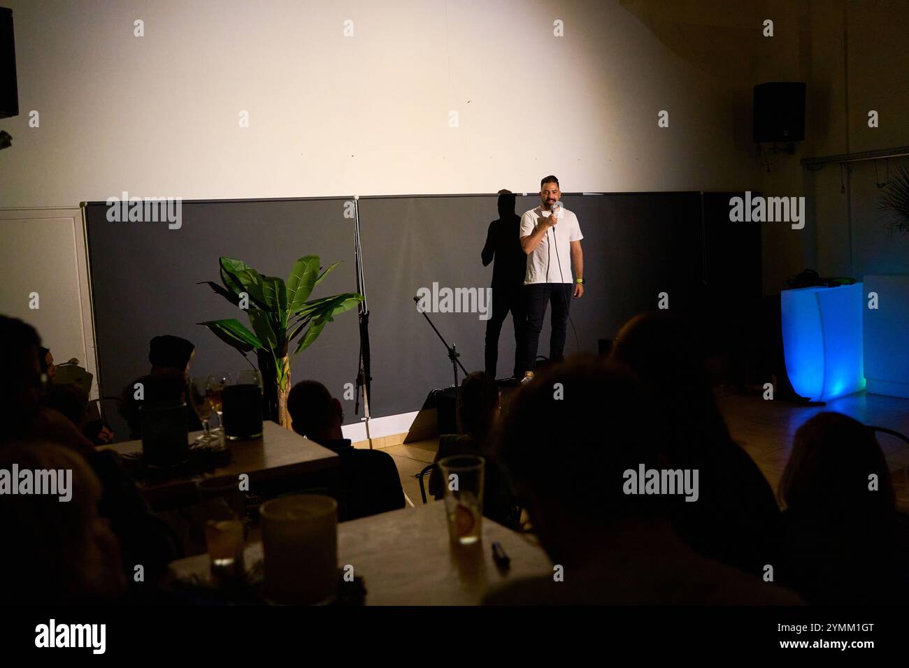 Male performer delivering a monologue on stage in an alternative ...