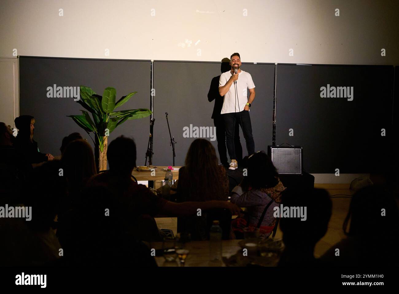 Male performer delivering a monologue on stage in an alternative ...