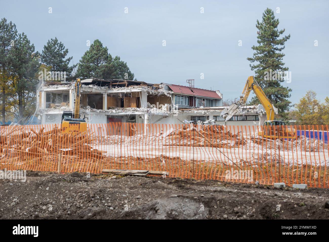 Demolishing an industrial house with a wrecker, bulldozer and plough ...