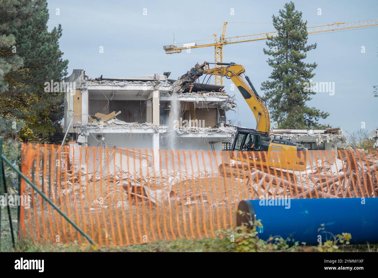 Demolishing an industrial house with a wrecker, bulldozer and plough ...