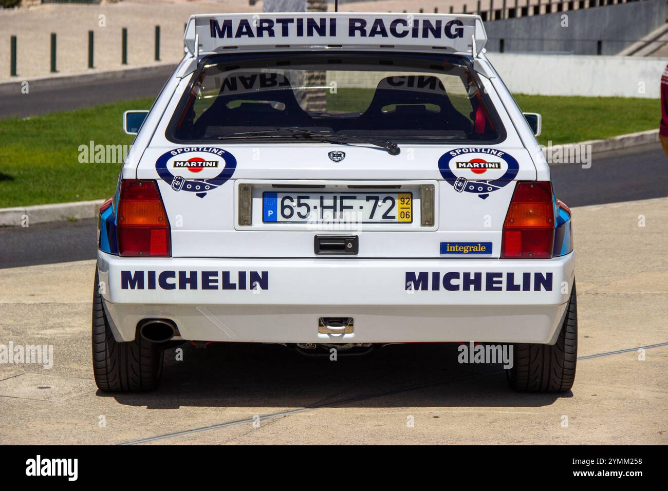 Rear view of a white lancia delta hf integrale evo showcasing martini ...