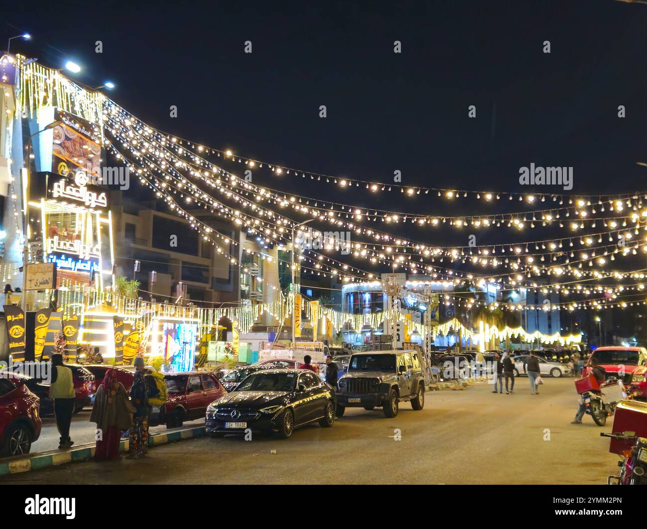 Cairo, Egypt, November 14 2024: lots of celebration lights in new Cairo city street at night ...
