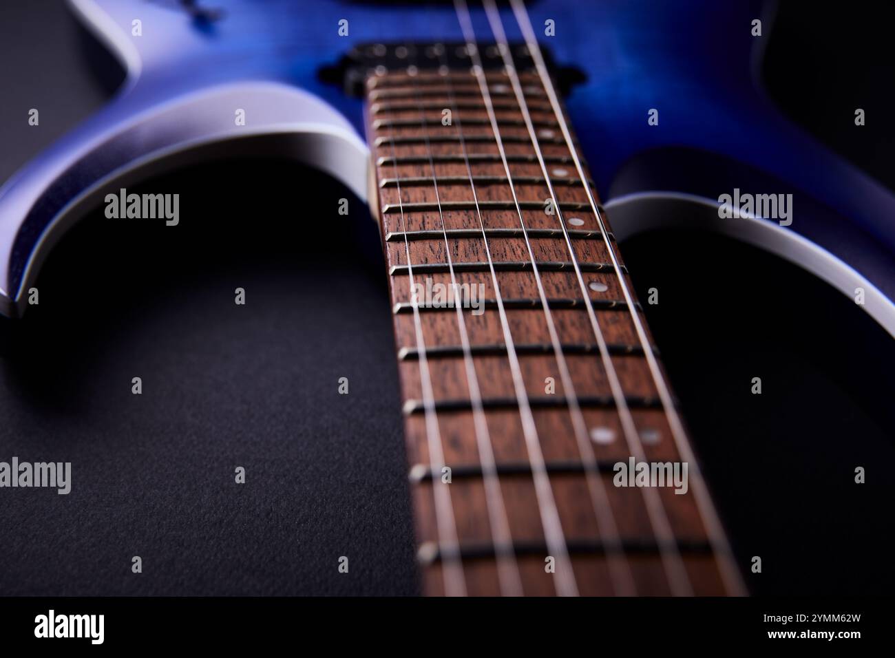 Fretboard of modern electric guitar. Close up Stock Photo - Alamy