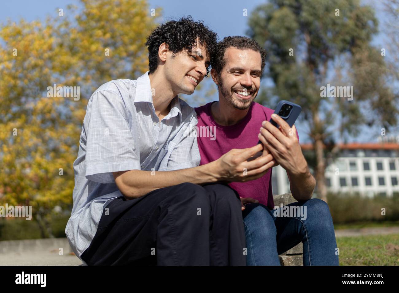 Two smiling friends phone hi-res stock photography and images - Alamy