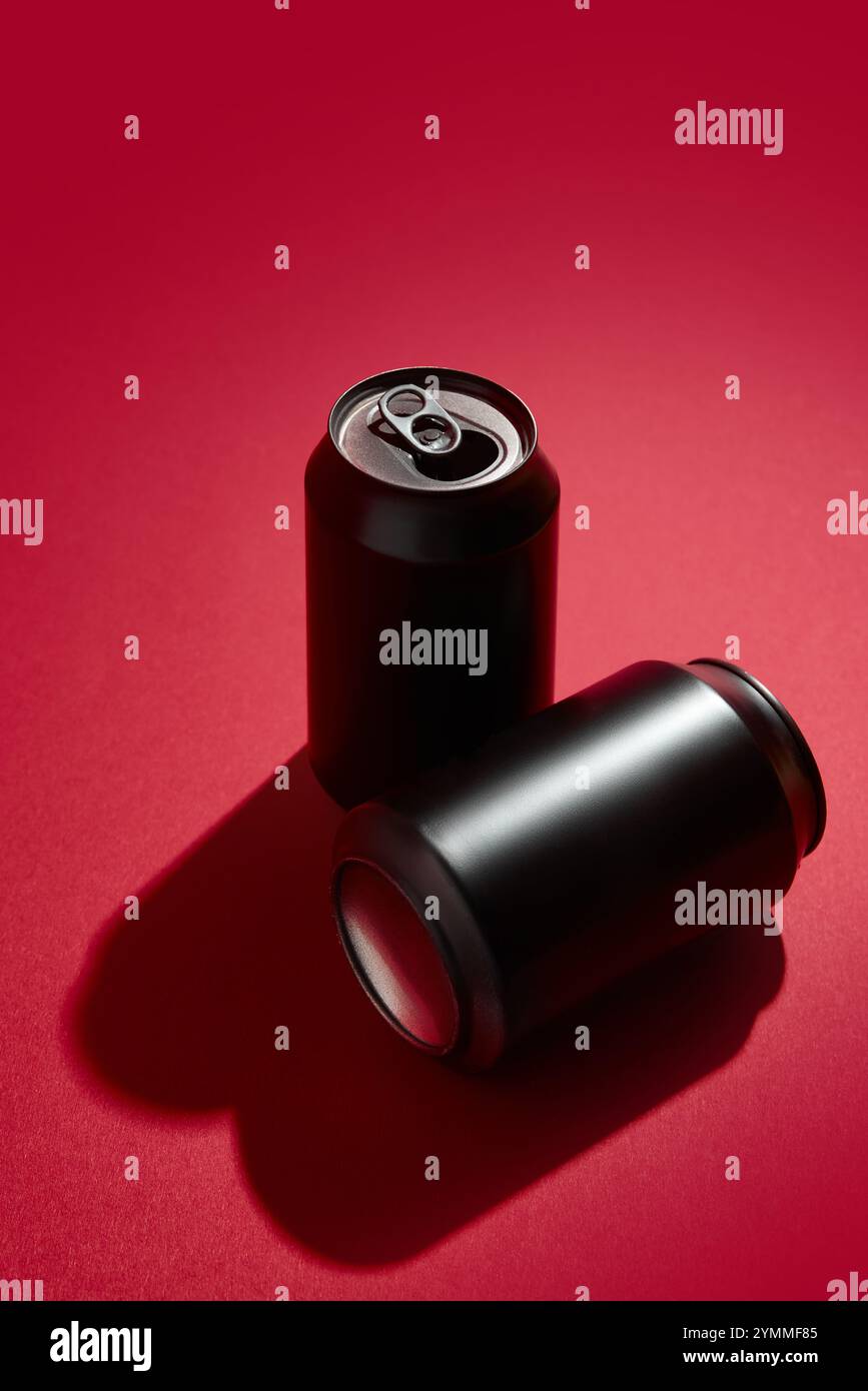 Two black aluminum beverage cans, for soda, beer, or energy drinks ...