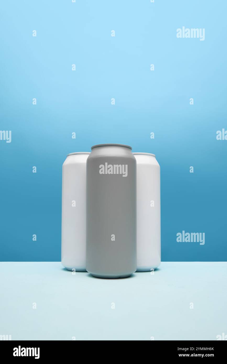Three stylish, minimalistic grey and white cans, set against blue ...