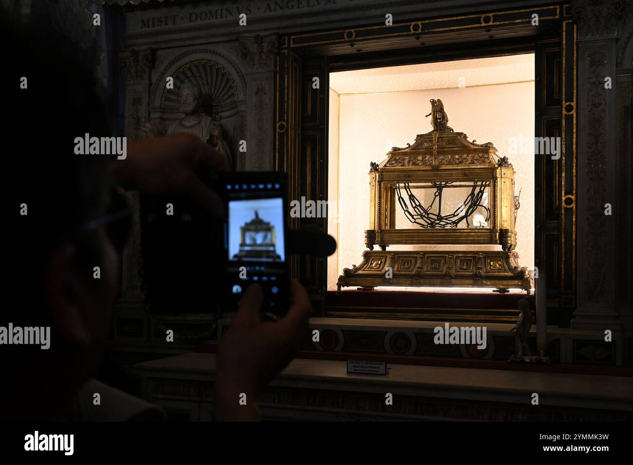 Rome, Italy - November 3, 2024: Visitors near the chains of St. Peter ...
