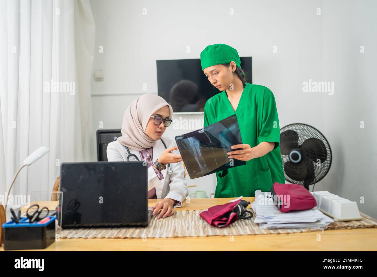Two medical professionals review hi-res stock photography and images ...