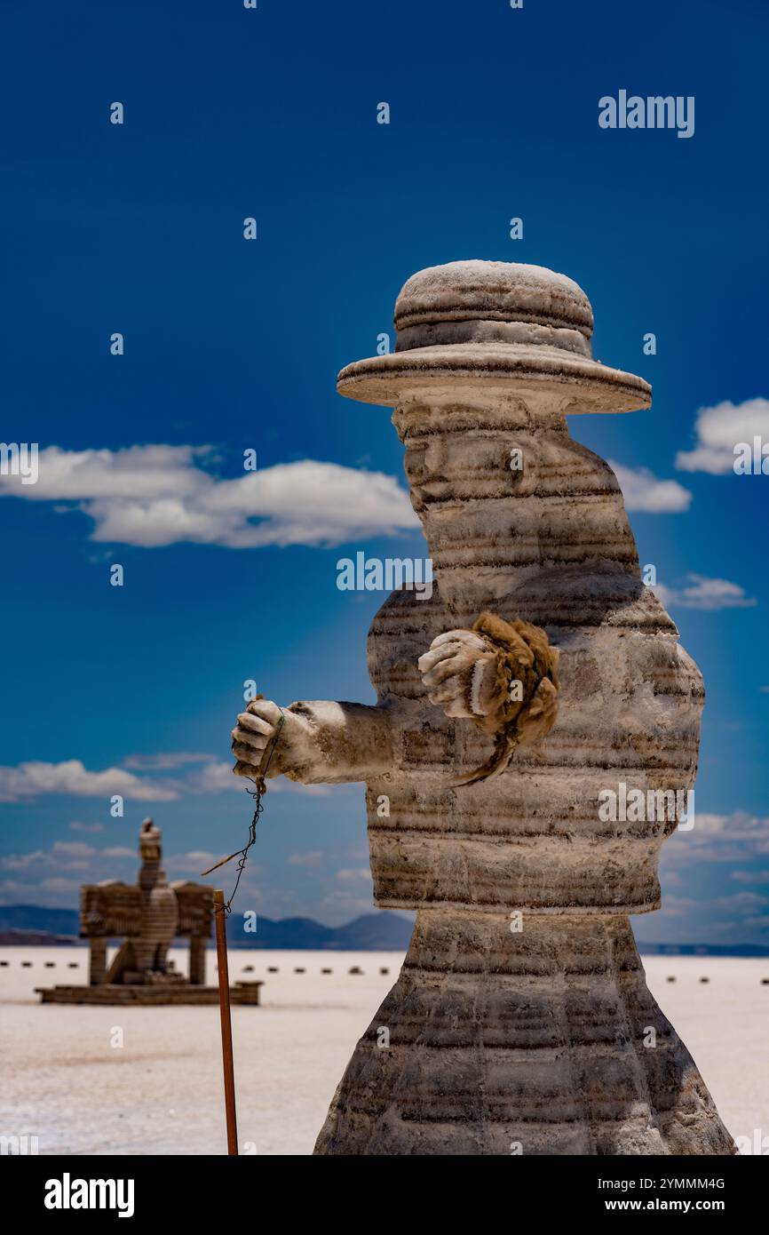 Salt statue representing a miner holding a pickaxe in salar de uyuni ...