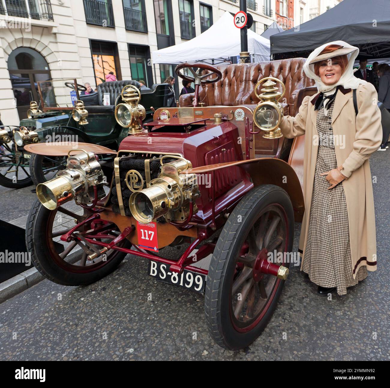 Lady in Period Dress, poses besides a 1902, Panhard et Levassor veteran ...