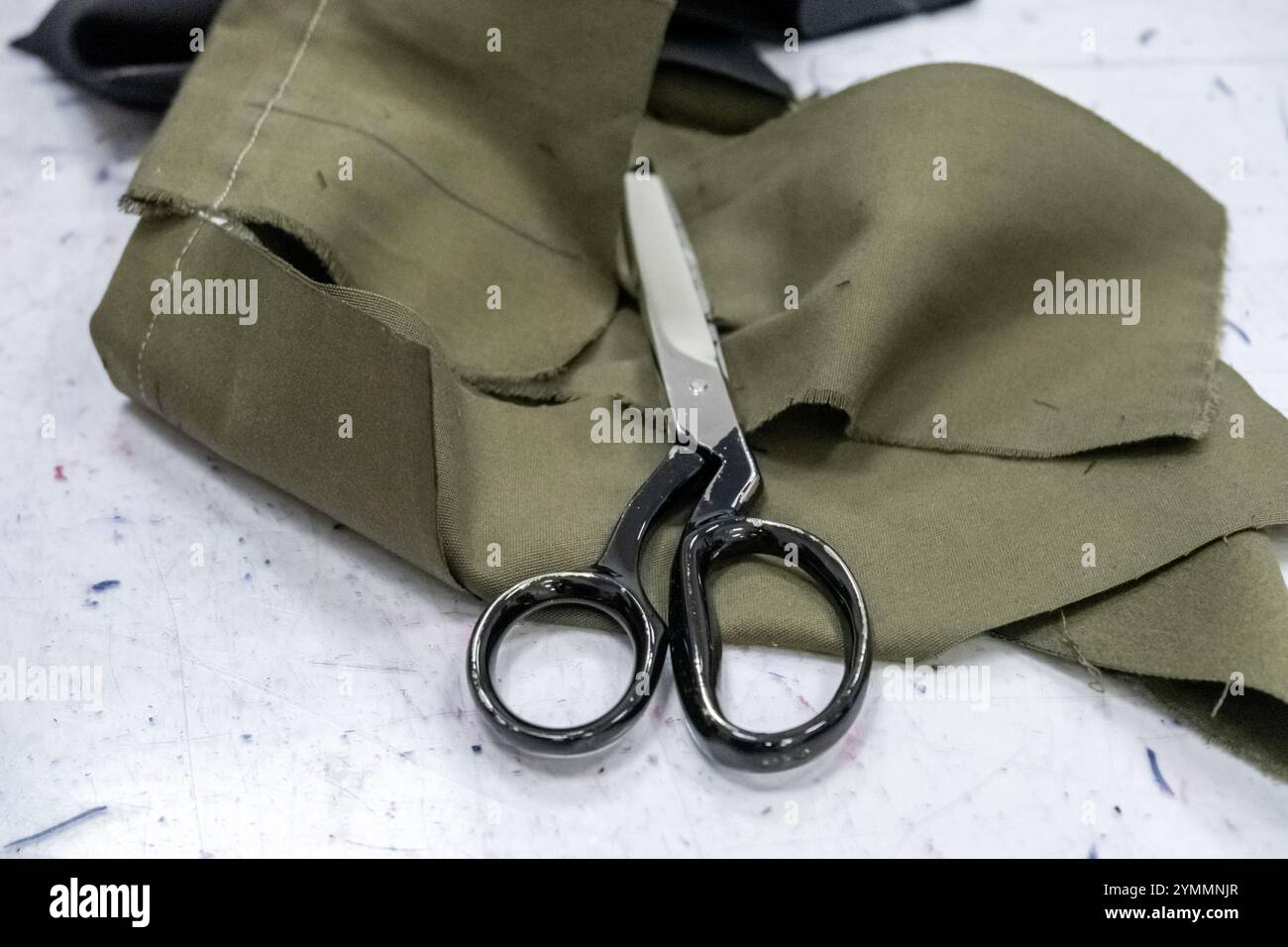 Tailor cutting fabric scissors hi-res stock photography and images - Alamy