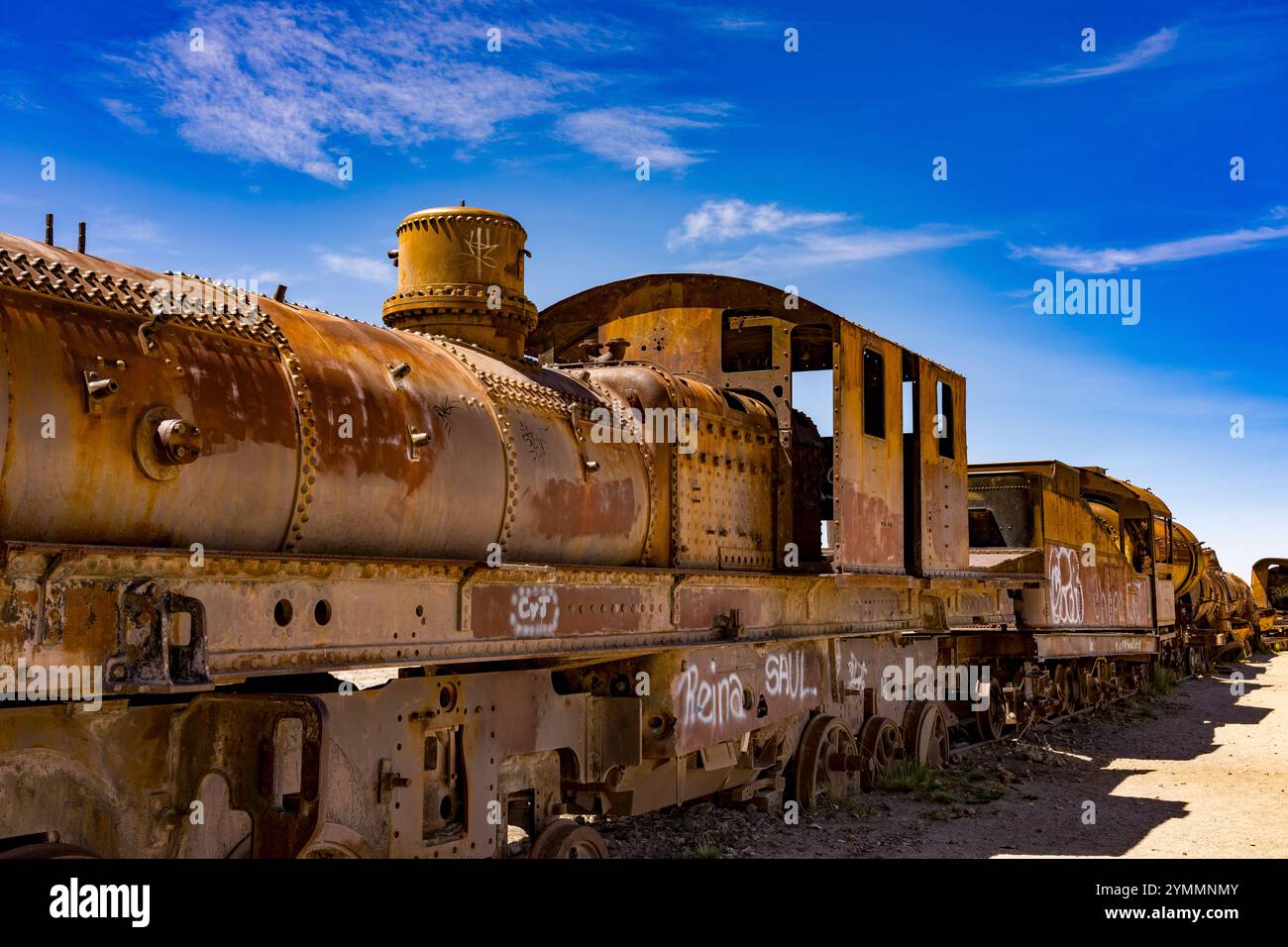 Old, rusty train decays under the scorching sun in uyuni, bolivia's ...