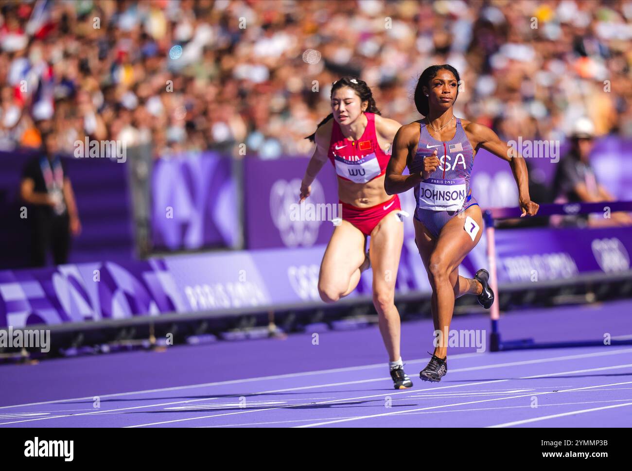 Alaysha Johnson participating in the 100 meters hurdles at the Paris ...