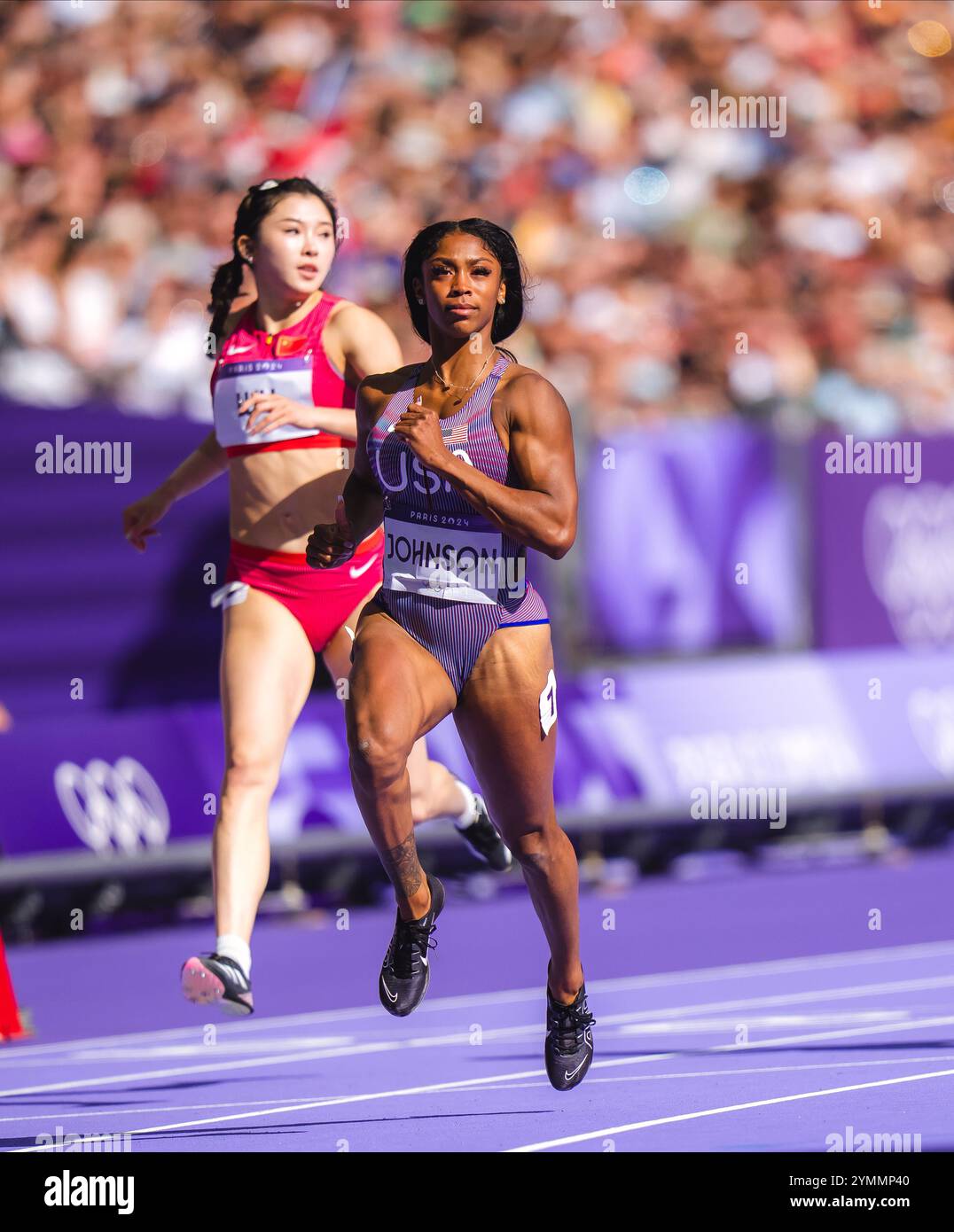 Alaysha Johnson participating in the 100 meters hurdles at the Paris ...