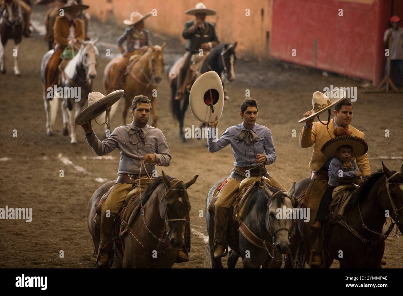 Mexican Charros acknowledge the audience as they raise their sombreros ...