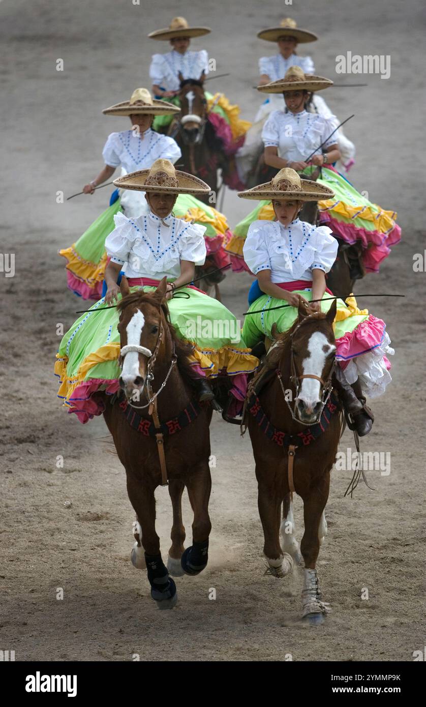Female riders or amazonas compete in an Escaramuza in Mexico City Stock ...