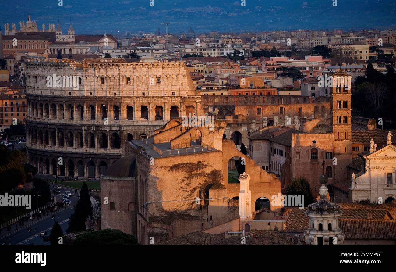 The Colosseum and the Roman forum are seen from the roof patio of Rome ...