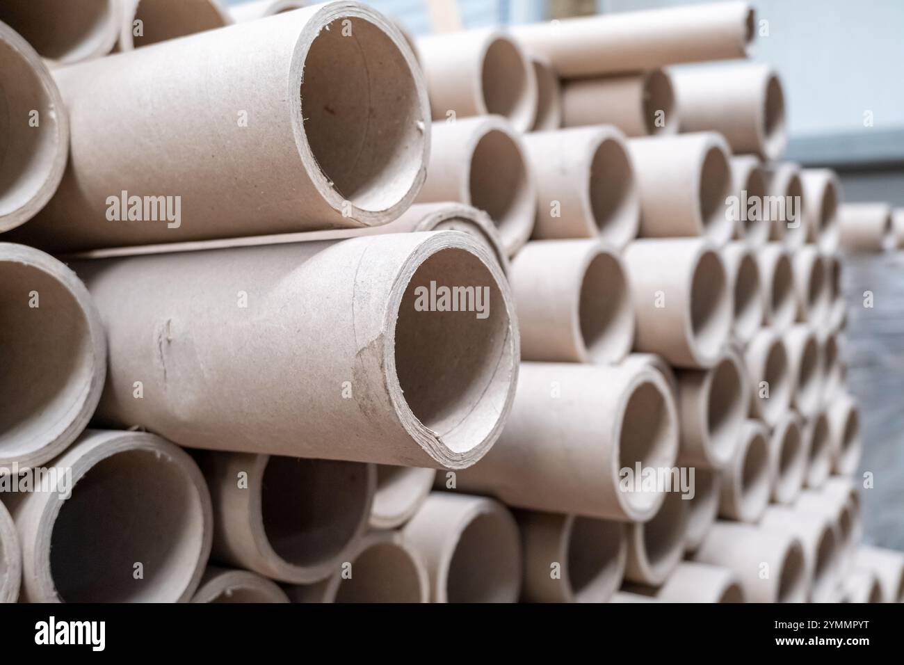 Close up view of stack of cylindrical cardboard tubes Stock Photo - Alamy
