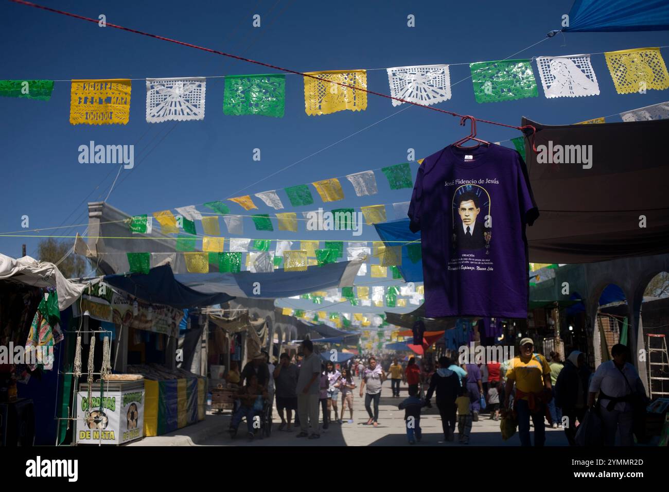 A street is decorated with traditional Mexican decorative flags during ...