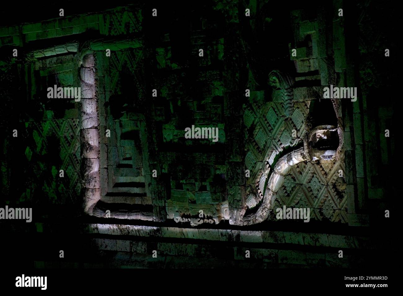 A sculpture of a serpent representing god Kukulkan is illuminated in ...