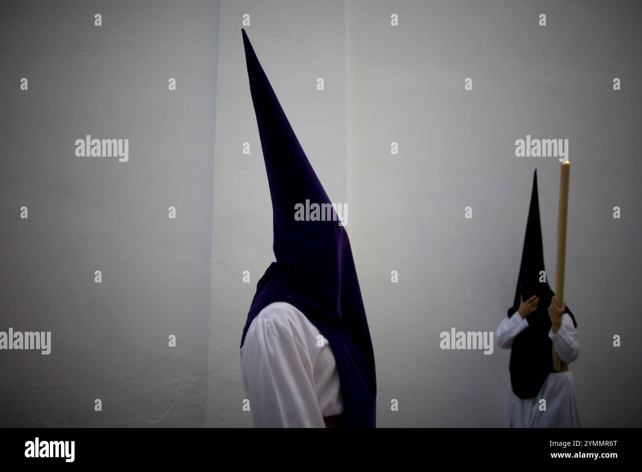 Penitents perform in an Easter Holy Week procession in Carmona village ...