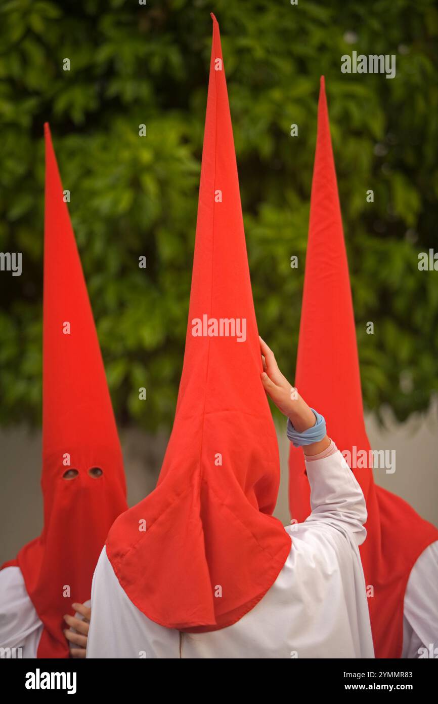 Penitent walk in a street during Easter Holy Week celebrations in ...