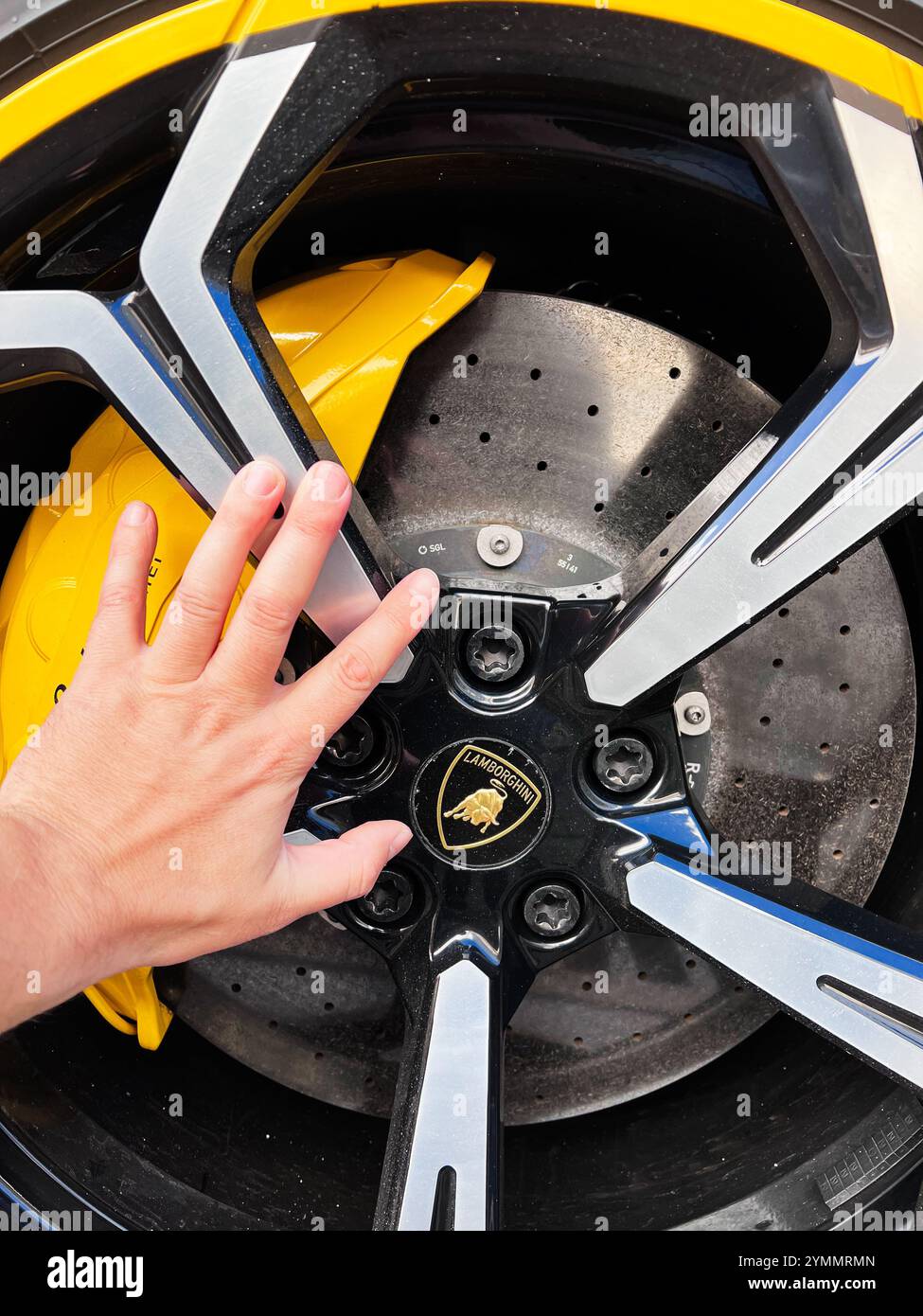 Kyiv, Ukraine - November 22, 2024: A close-up view of a hand touching a ...