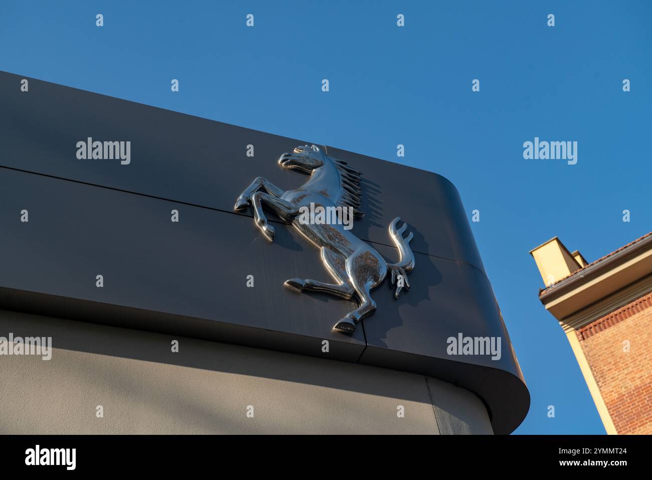 Ferrari is a symbol of prestige and power, a shop with the sign of the ...