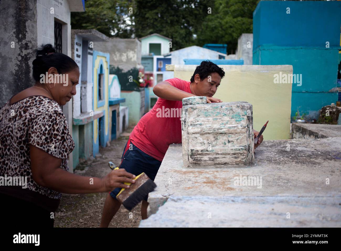 People cleaning tomb Stock Photo - Alamy