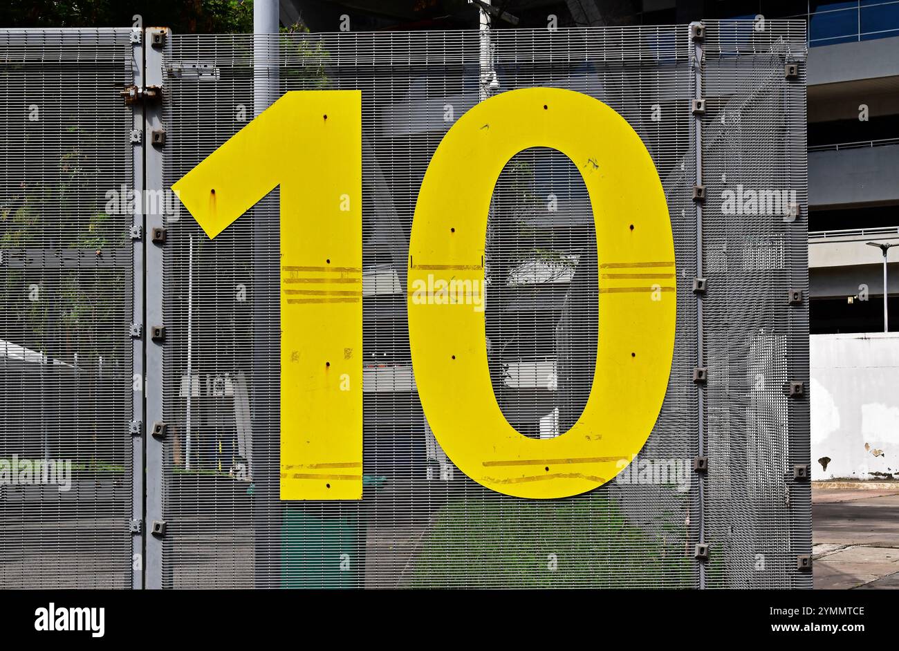 Number ten in metal on metallic grid Stock Photo - Alamy